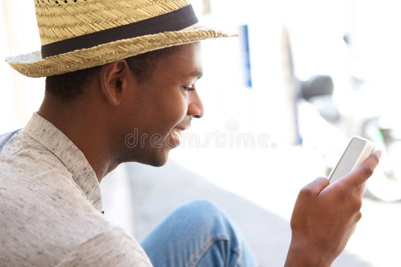 Young Man Reading Text Message on Cell Phone Stock Image - Image of ...