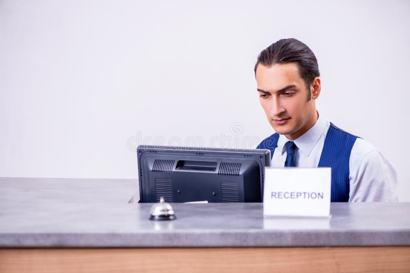 Young Man Receptionist at the Hotel Counter Stock Image - Image of male ...