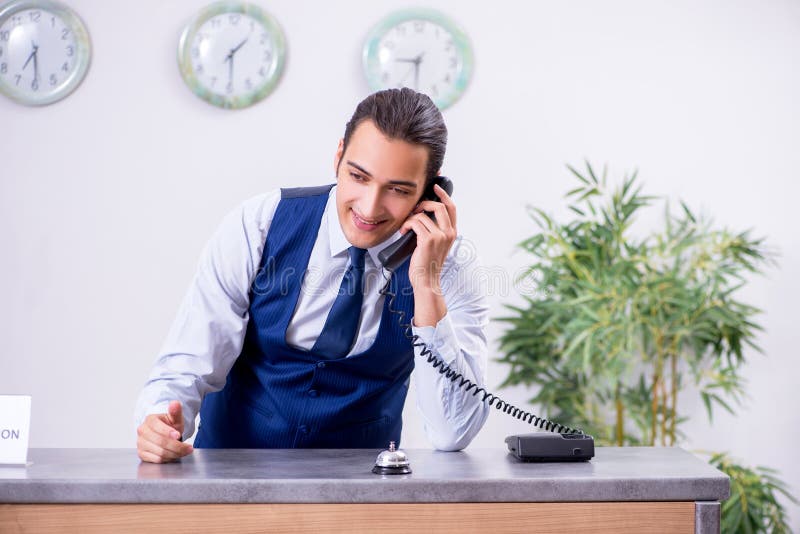 Young Man Receptionist at the Hotel Counter Stock Image - Image of ...