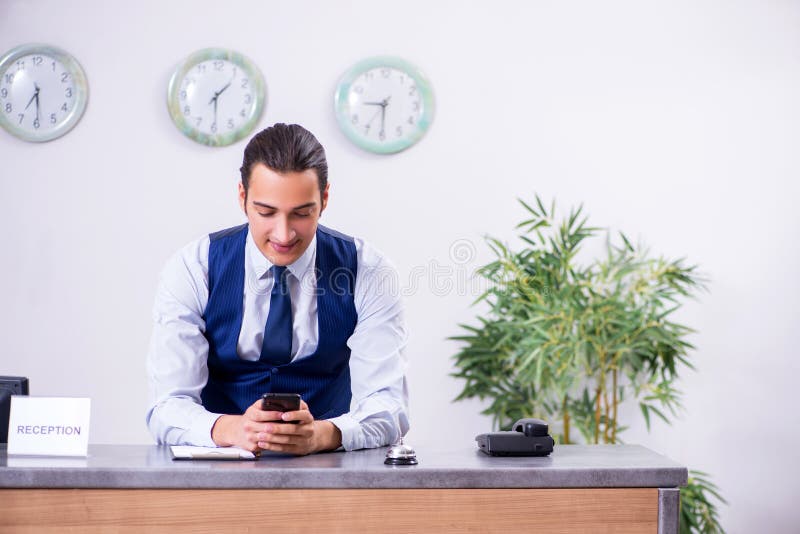 Young Man Receptionist at the Hotel Counter Stock Image - Image of ...