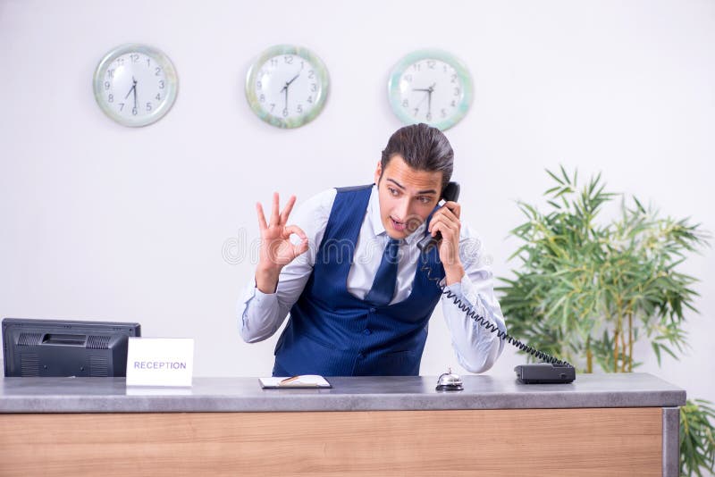 Young Man Receptionist at the Hotel Counter Stock Photo - Image of male ...