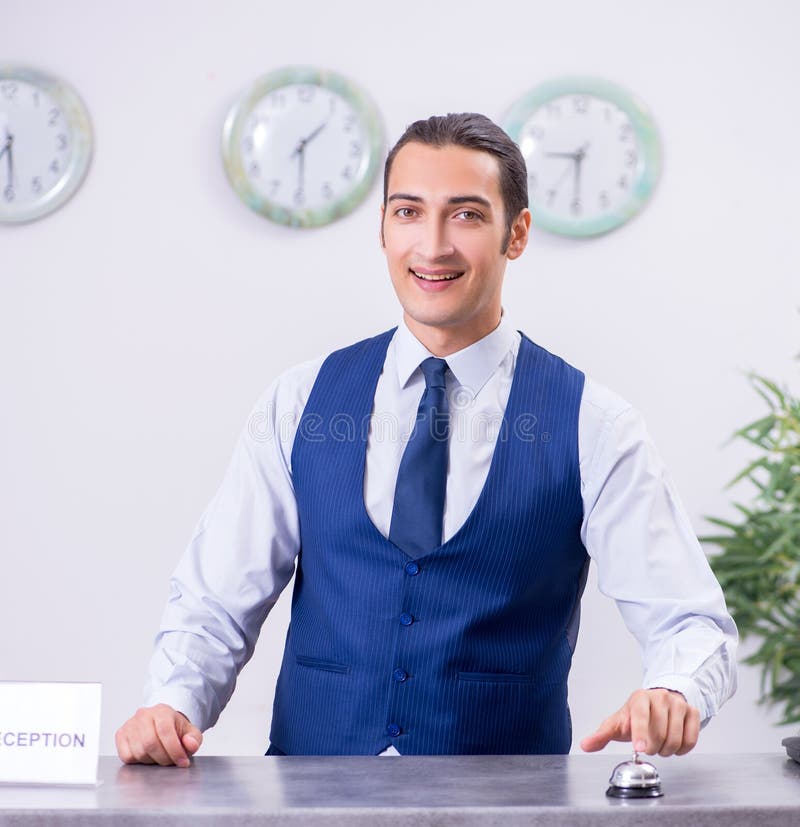 Young Man Receptionist at the Hotel Counter Stock Photo - Image of ...