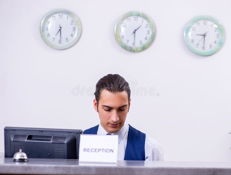 Young Man Receptionist at the Hotel Counter Stock Photo - Image of ...