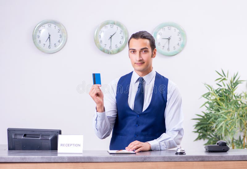 Young Man Receptionist at the Hotel Counter Stock Image - Image of ...