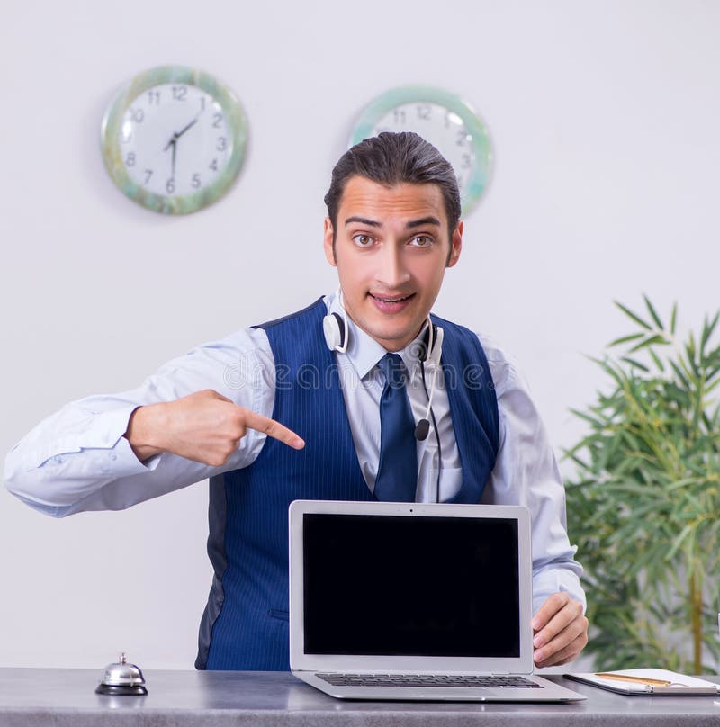 Young Man Receptionist at the Hotel Counter Stock Photo - Image of ...