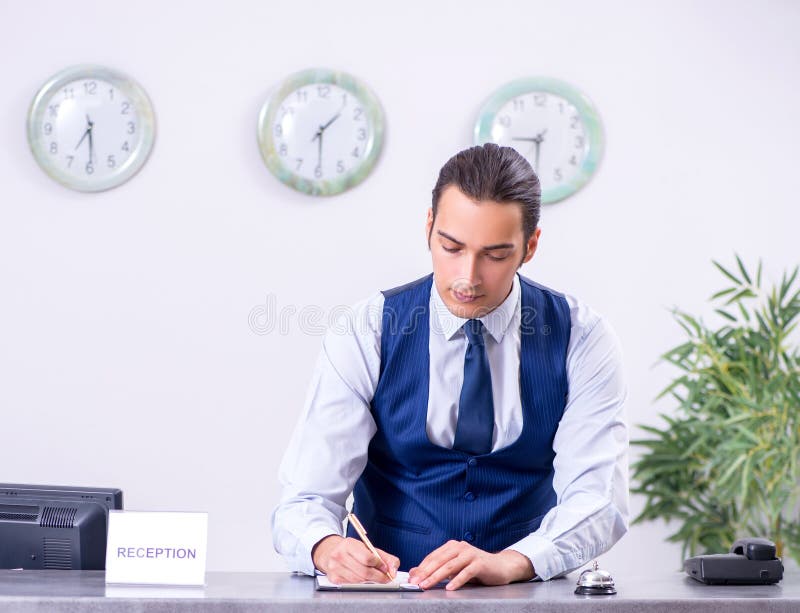 Young Man Receptionist at the Hotel Counter Stock Photo - Image of ...