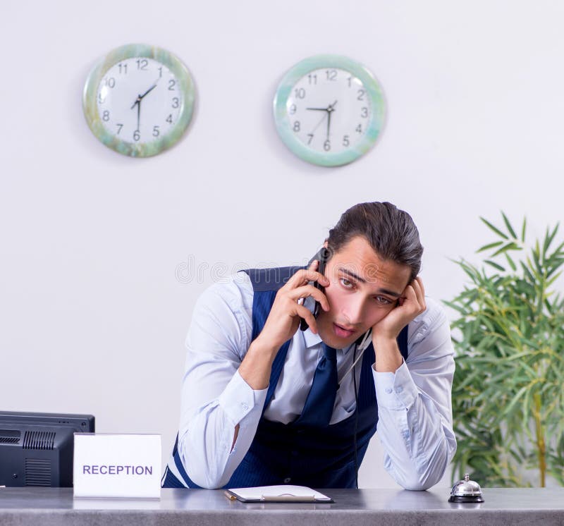 Young Man Receptionist at the Hotel Counter Stock Image - Image of ...