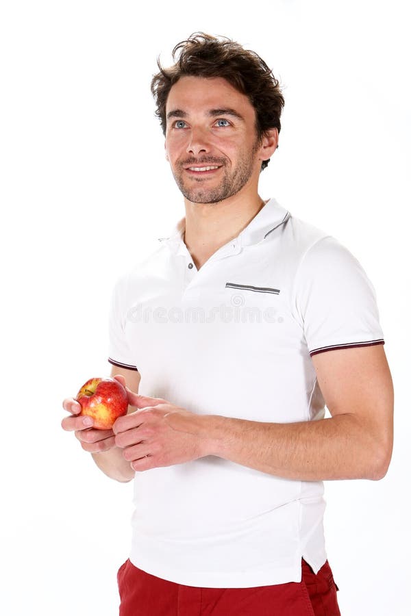 Young man with a red apple stock photo. Image of fruit - 34036556