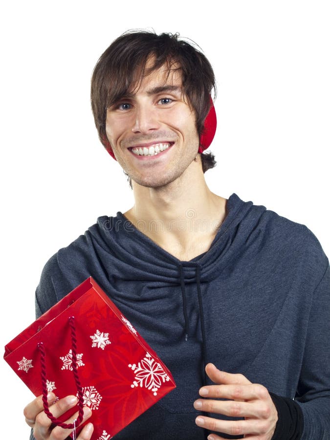 Young Man with a Red Gift Bag Stock Photo - Image of gift, earmuffs ...