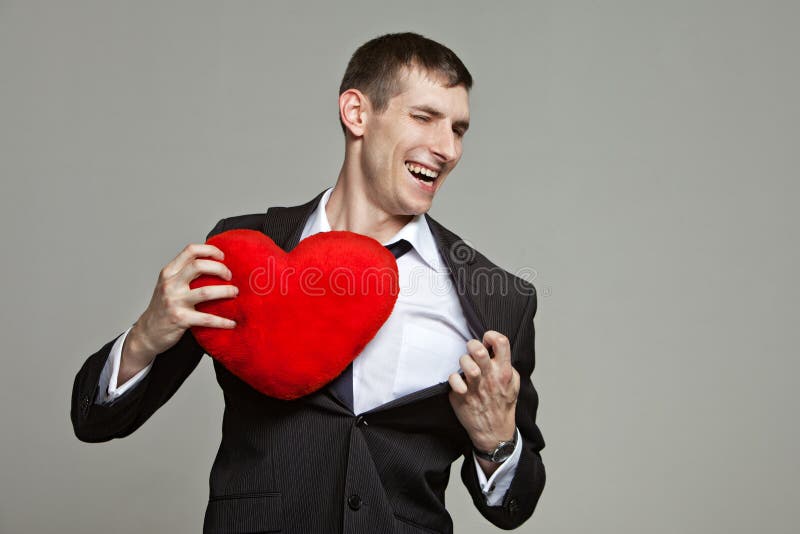 A Young Man with a Red Heart Stock Photo - Image of hand, heart: 49679128