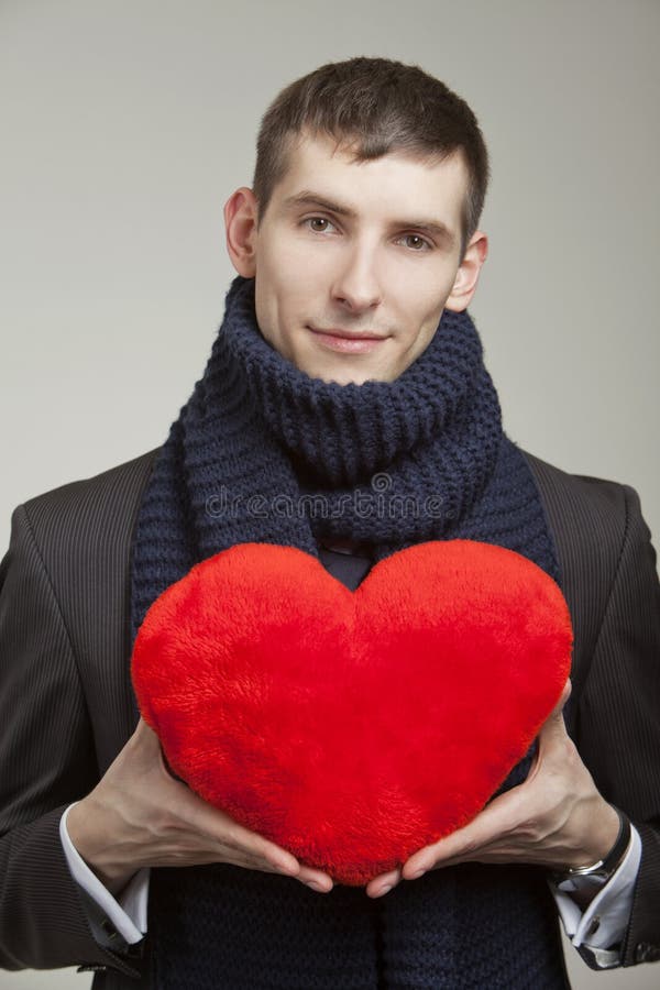 A Young Man with a Red Heart Stock Image - Image of black, young: 49679135