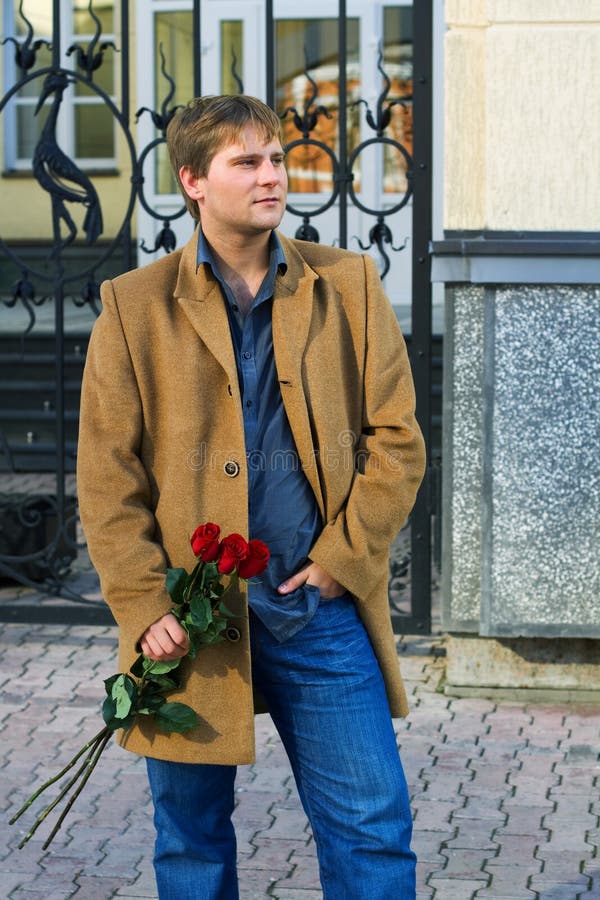 Young man with a red roses stock image. Image of cute - 11742865