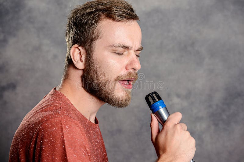 Young Man in Red Shirt Singing in Microphone Stock Photo - Image of ...