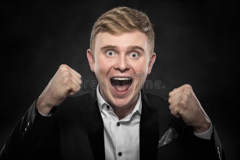 Young man rejoicing. stock photo. Image of happiness - 68492376