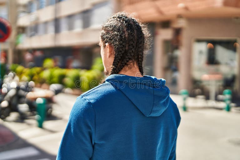 Young Man with Relaxed Expression Standing on Back View at Street Stock ...