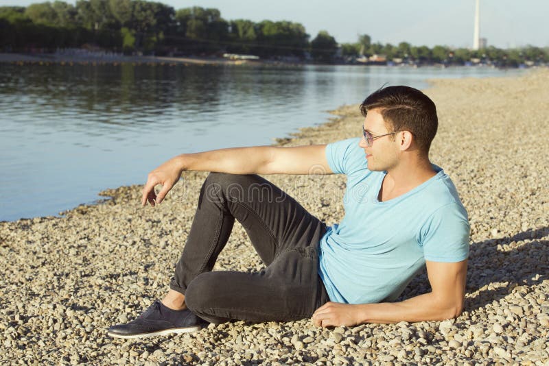 Young Man Relaxing at the Beach Stock Photo - Image of beach, nature ...