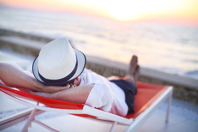 Young Man Relaxing on the Beach Stock Image - Image of relaxing, chair ...