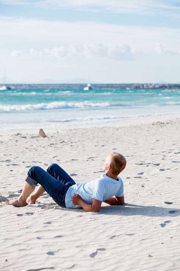 Young Man is Relaxing on Beach in Summer Vacation Stock Image - Image ...