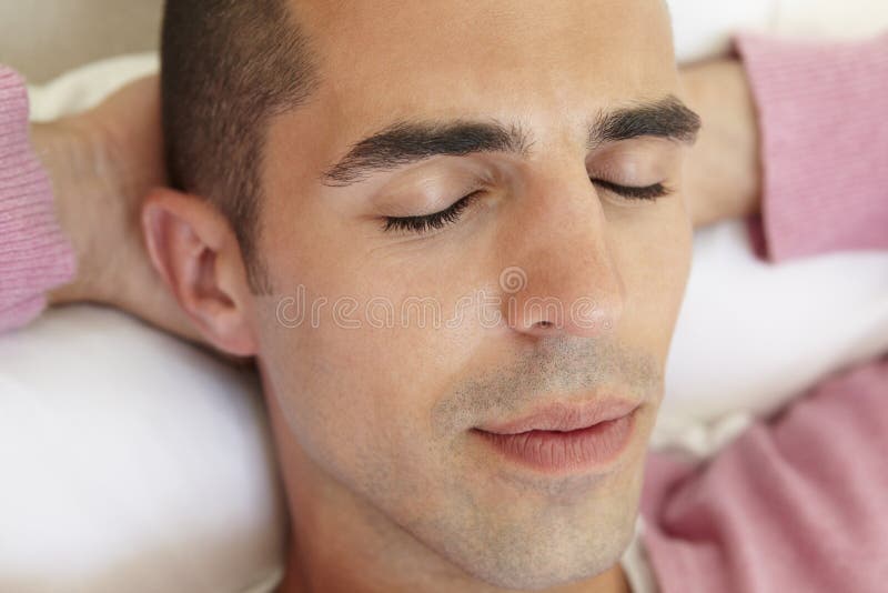 Young Man Relaxing on Bed stock photo. Image of camera - 54955624