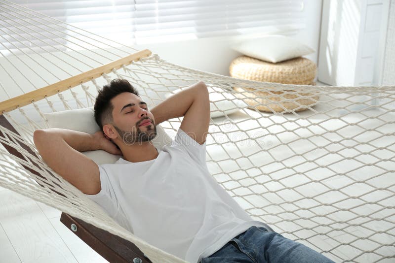 Young Man Relaxing in Hammock Stock Image - Image of decor, netting ...