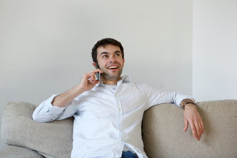 Young Man Relaxing at Home Calling by Mobile Phone Stock Photo - Image ...