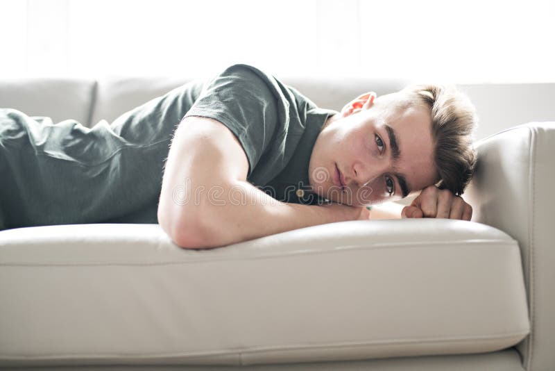 Young Man Relaxing at Home on the Sofa Feel Depress Stock Photo - Image ...