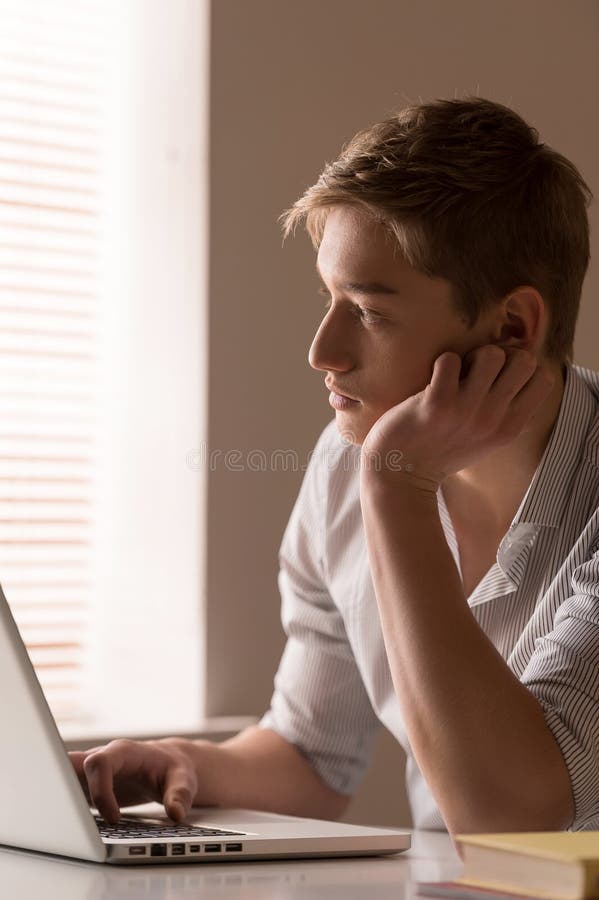 Men Relaxing with Laptop. Young Cheerful Men Using Laptop while Stock ...