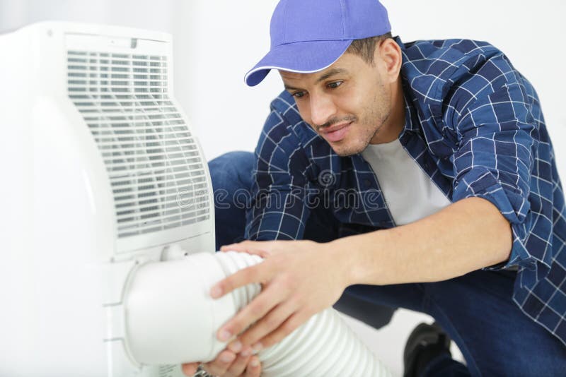 Young Man Repairing Air Conditioner Standing on Stepladder Stock Image ...