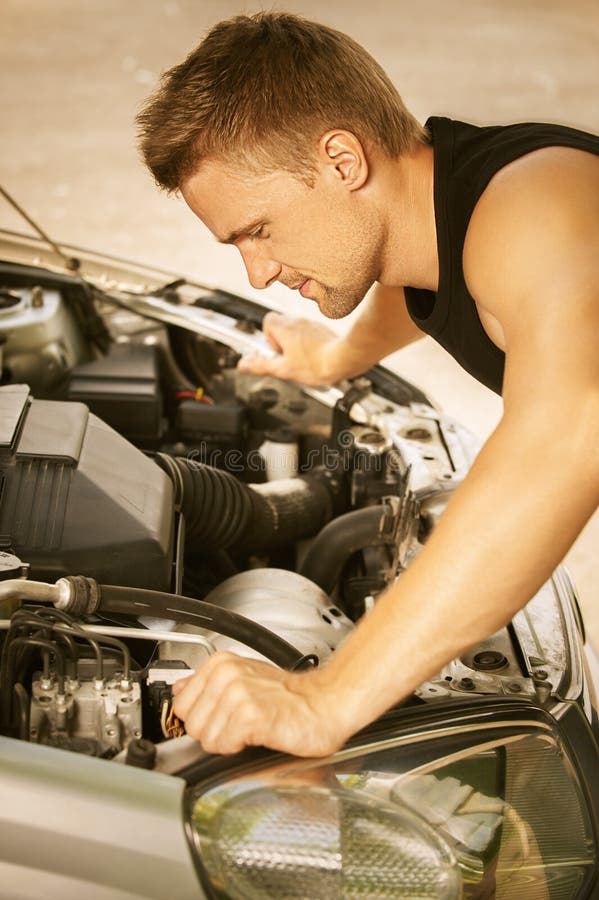 Fixing Car at Auto Repair Shop Stock Photo - Image of person, repairing ...