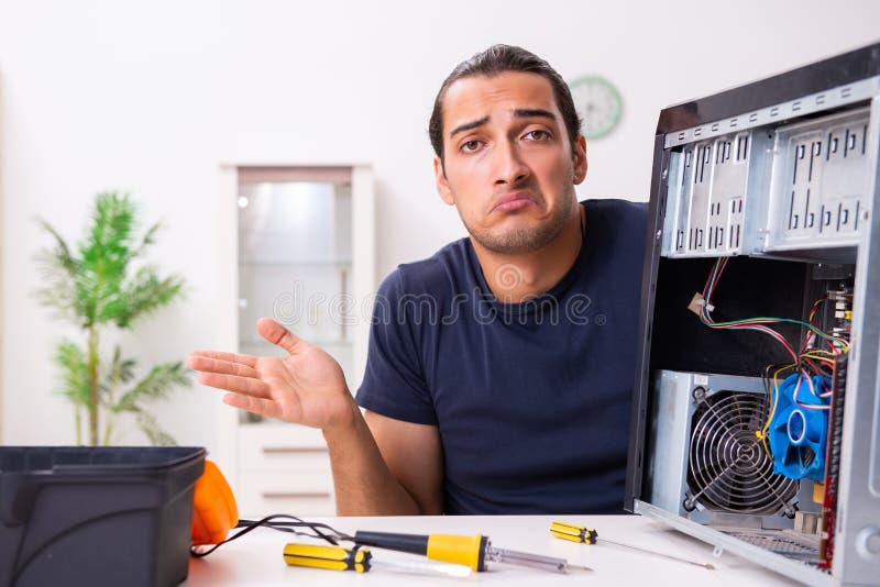 Young Man Repairing Computer at Home Stock Photo - Image of diagnosing ...