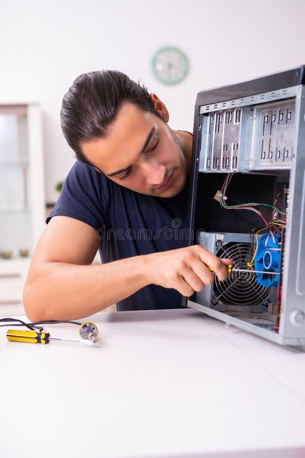 Young Man Repairing Computer at Home Stock Photo - Image of contractor ...