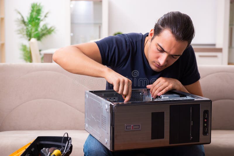 Young Man Repairing Computer at Home Stock Photo - Image of device ...