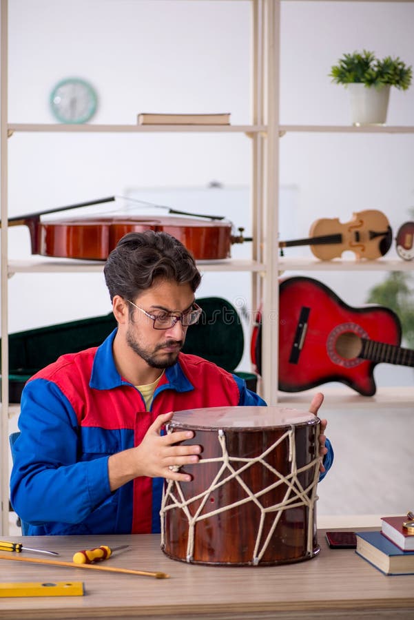 Young Man Repairing Musical Instruments at Workshop Stock Image - Image ...