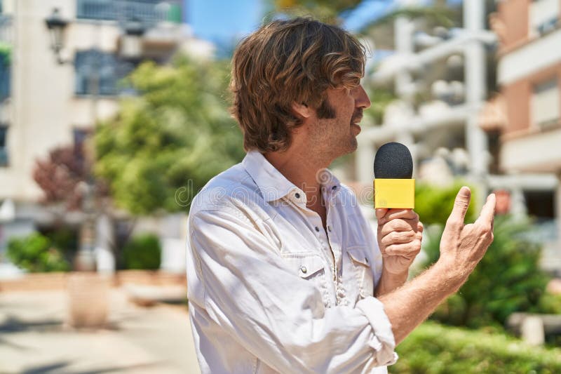 Young Man Reporter Working Using Microphone at Park Stock Photo - Image ...