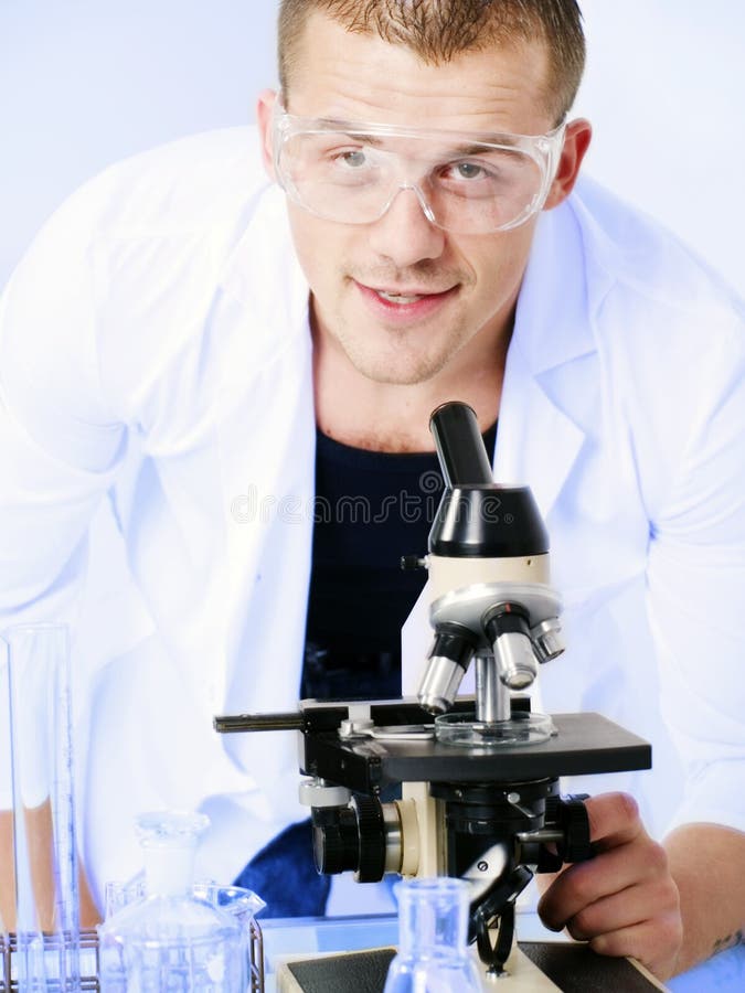 Young Man Researching on a Microscope Stock Image - Image of human ...