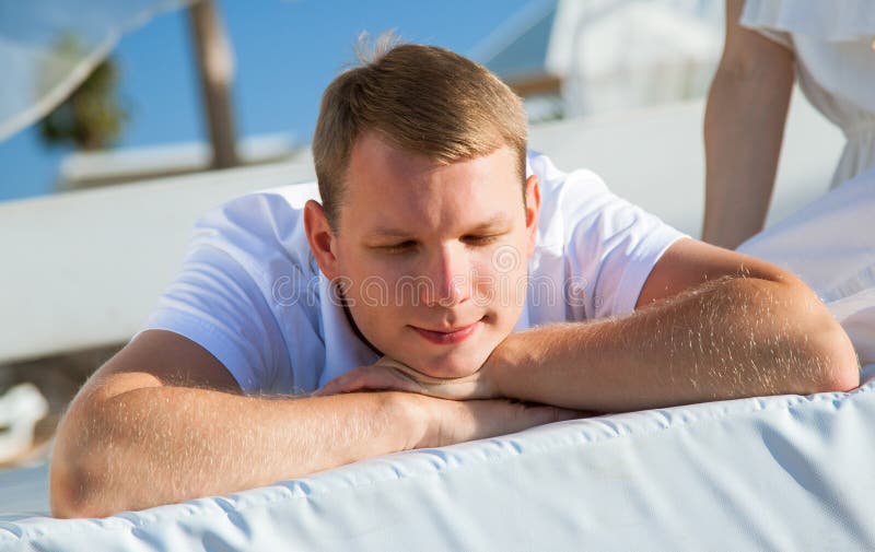 Young Man Resting on a Beach Stock Image - Image of beautiful, closed ...