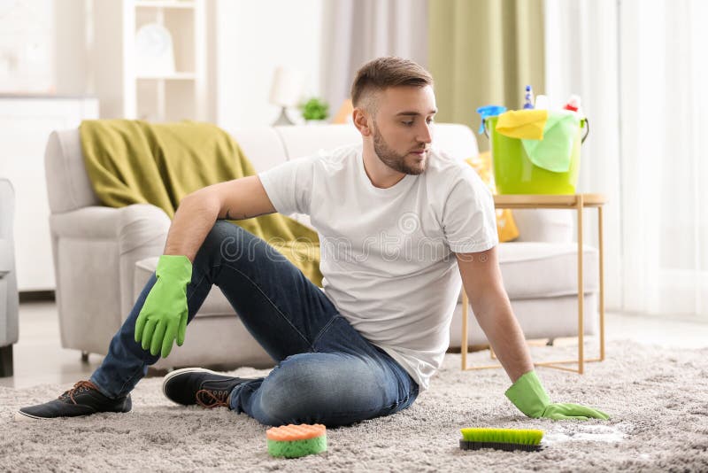 Young Man Resting after Cleaning His Flat Stock Photo - Image of ...