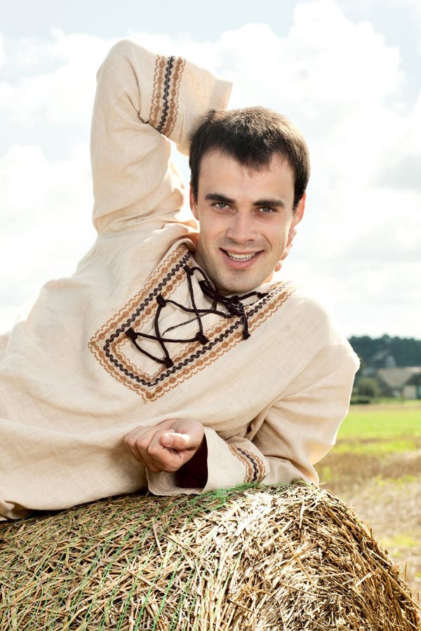Young Man Resting on a Haystack Stock Photo - Image of clothing ...