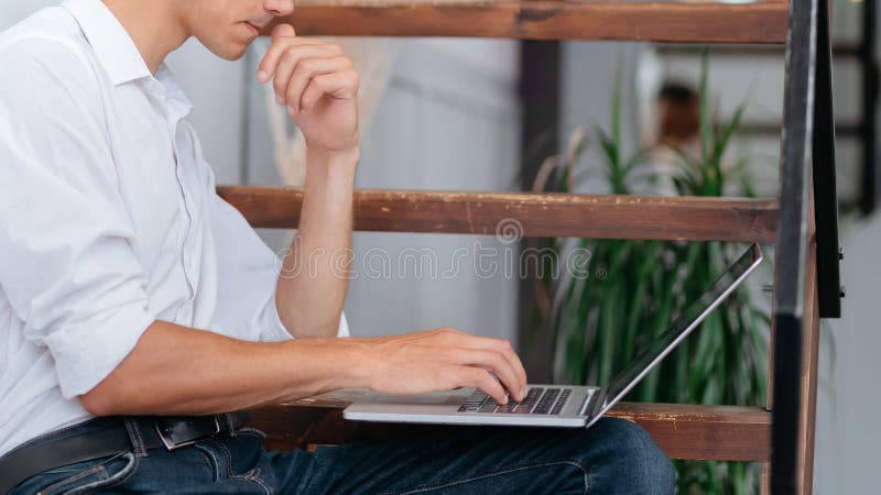 Young Man Resting at His House and Using Laptop Stock Photo - Image of ...