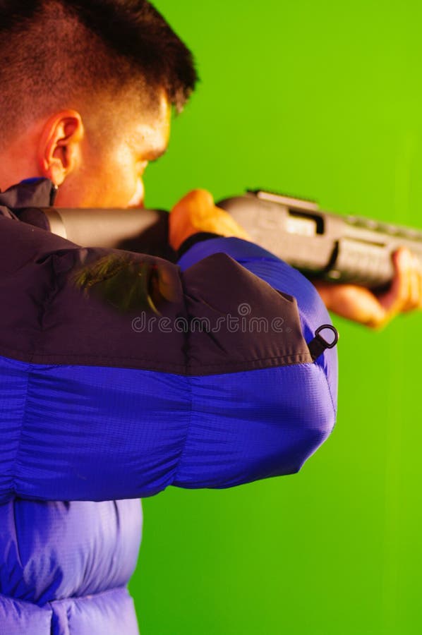 Young man with revolver stock image. Image of shotgun - 94277233