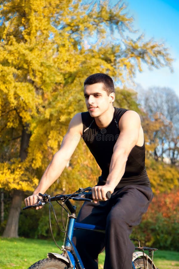 Young Man Ride a Bike in Autumn Park Stock Photo - Image of healthy ...
