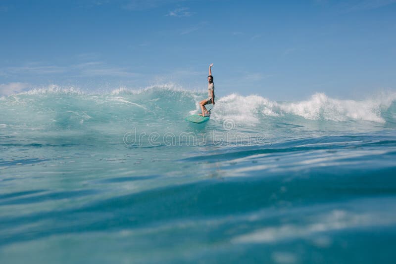Young Man Riding Blue Ocean Waves on Surfboard Stock Photo - Image of ...