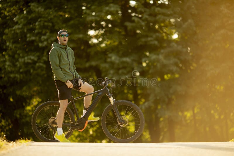 Young Man Riding Ebike in Nature Stock Image - Image of male, equipment ...
