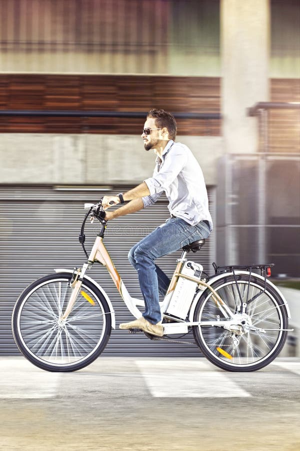Young Man Riding Electric Bicycle Stock Photo - Image of business ...