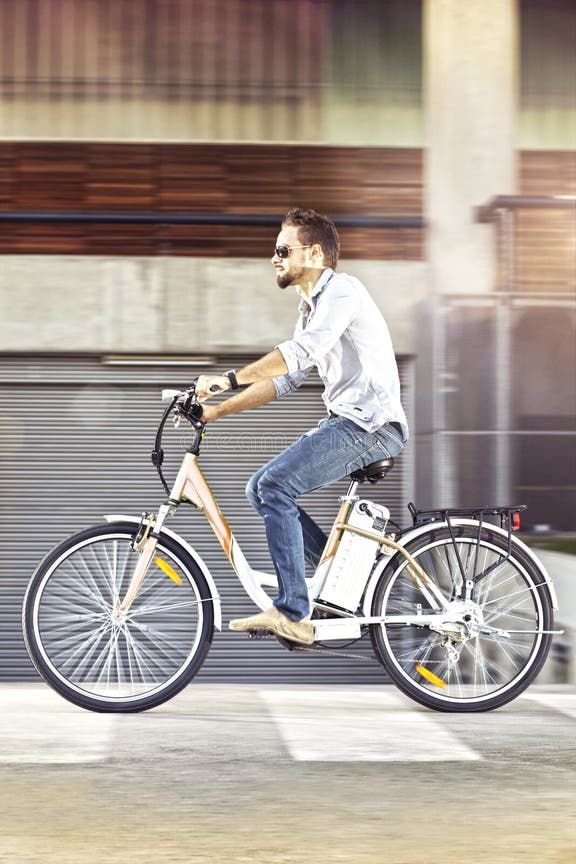 Young Man Riding Electric Bicycle Stock Photo - Image of business ...