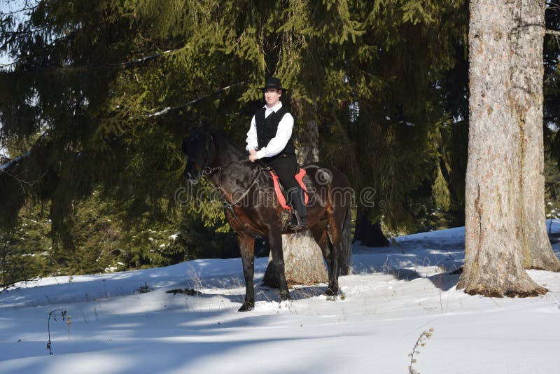 Young Man Riding Horse Outdoor in Winter Stock Image - Image of forest ... Young Man Riding Horse Outdoor in Winter Stock Image - Image of forest ...