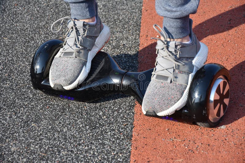 Young Man Riding on the Hoverboard in the Park Stock Image - Image of ...