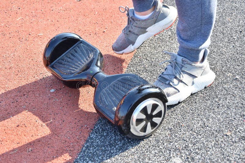 Young Man Riding on the Hoverboard in the Park Stock Photo - Image of ...