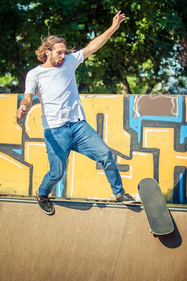 Young Man Riding Skate at Park and Falling Down Stock Image - Image of ...