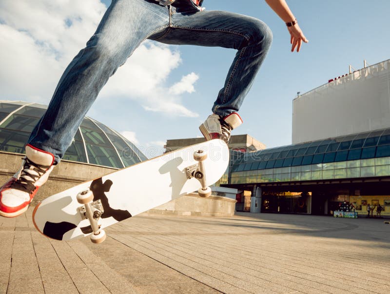 Young Man Riding a Skateboard. Town Square. Stock Image - Image of road ...